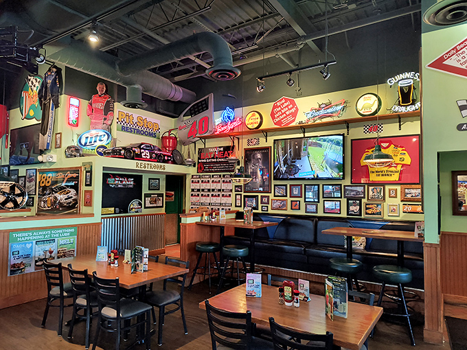 Racing memorabilia covers every inch of wall space, creating an atmosphere where Dale Earnhardt Jr. would feel right at home ordering a burger.