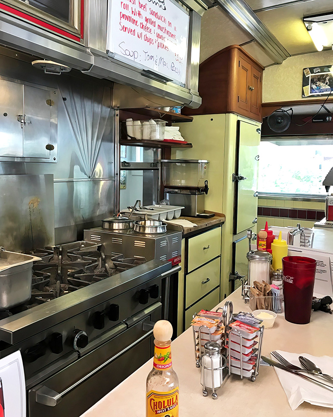 Behind the scenes magic where spatulas dance and eggs transform. This tiny kitchen somehow produces infinite comfort on a plate.