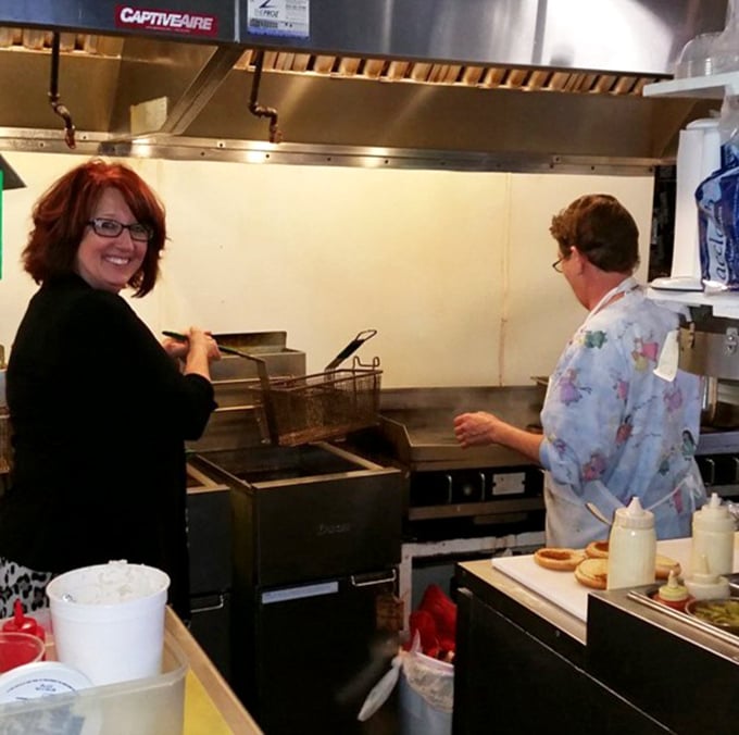 The kitchen - where burger magic happens. No fancy equipment, just decades of know-how and a well-seasoned grill.