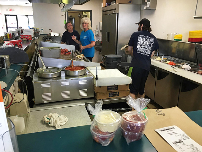 Staff members share a laugh between orders &ndash; the secret ingredient here might just be genuine workplace happiness.