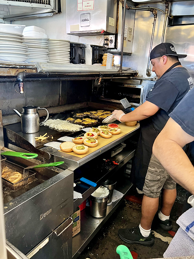 The ballet of the grill. Watch as buns toast alongside patties while onions caramelize in a choreographed dance of deliciousness.