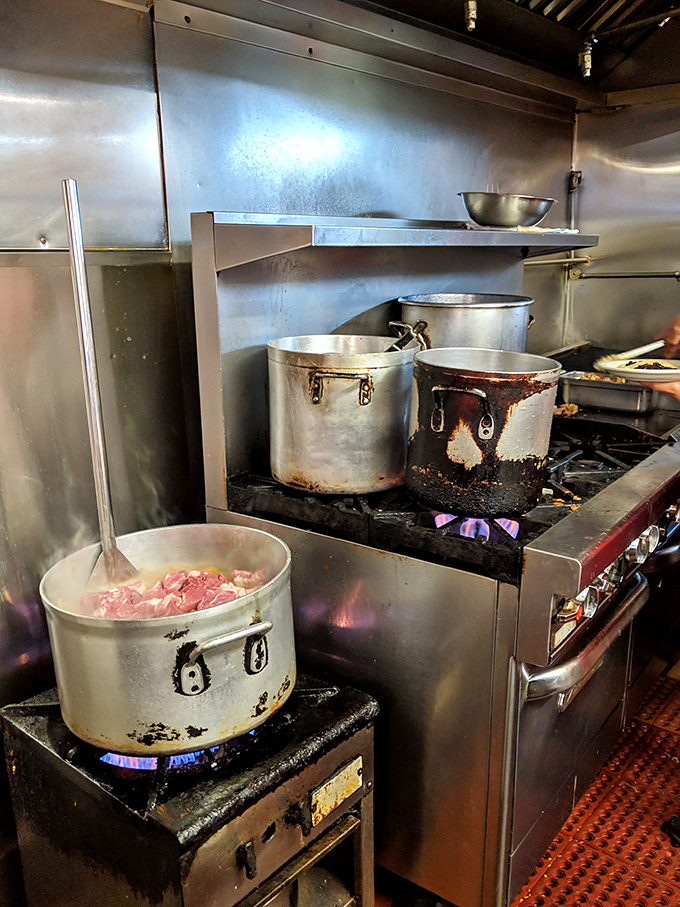 Behind the scenes where the magic happens – well-seasoned pots bubbling with promises that will soon be wrapped in tortillas.