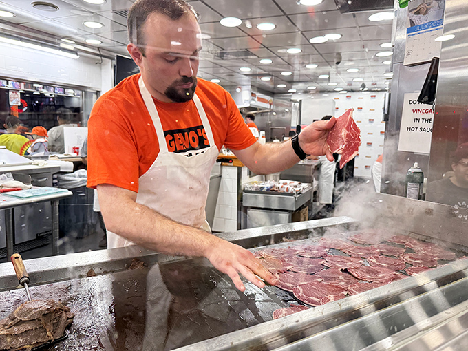 The maestro at work, transforming simple ingredients into edible poetry. There's something hypnotic about watching a professional handle meat with such confidence.