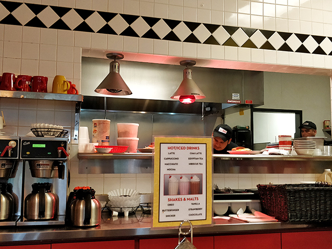 The kitchen's heart is on full display &ndash; heat lamps glowing like beacons of hope for hungry patrons awaiting their comfort food fix.