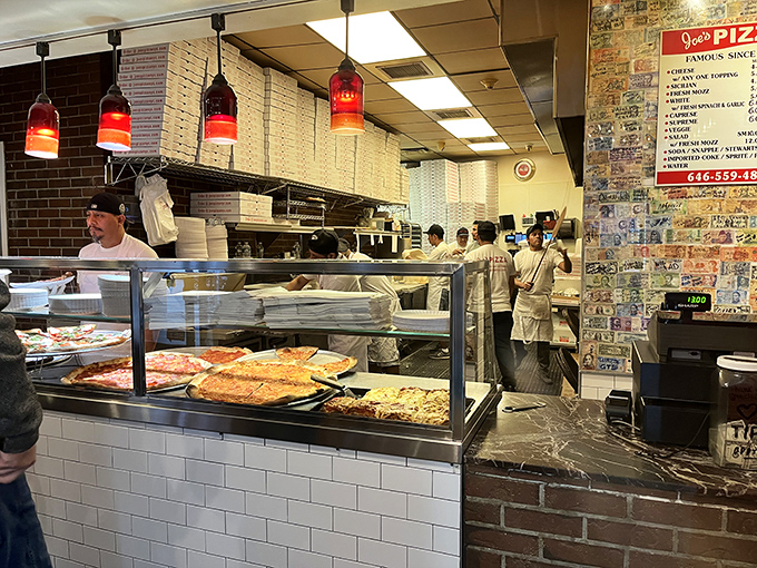 Where the magic happens—Joe's kitchen crew orchestrating the pizza ballet with the precision of seasoned Broadway performers.