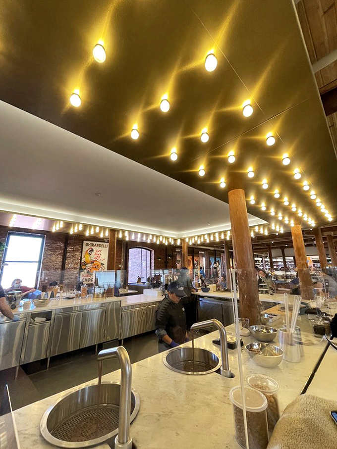 Spotlights on the ceiling create a chocolate galaxy above, as if the universe itself is celebrating your decision to indulge.