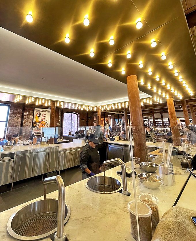 Where the magic happens: skilled chocolatiers creating edible works of art under golden lights that seem to whisper, "Stay awhile."