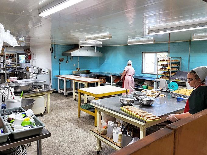 The kitchen where magic happens daily. Those aren't just bakers &ndash; they're artists whose canvas happens to be flour, sugar, and butter.