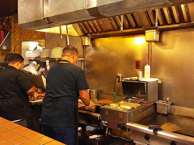 Where the magic happens&mdash;skilled hands working with practiced precision. The kitchen ballet that turns ingredients into memories.