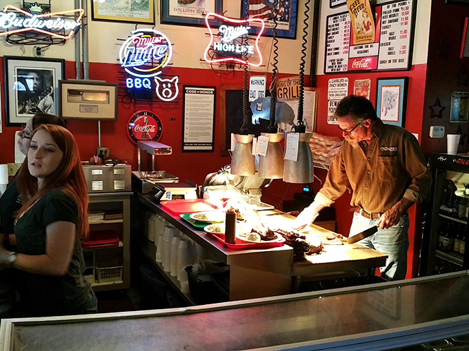 Behind the counter, where smoke wizards transform humble cuts into the stuff of local legend.