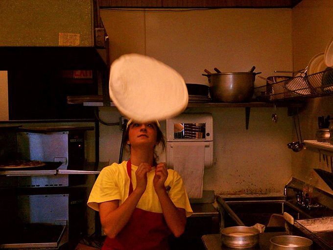 Behind every great pizza is someone tossing dough with the confidence of a circus performer and the precision of a surgeon.