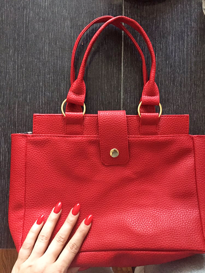 This vibrant red handbag isn't just an accessory&mdash;it's the exclamation point at the end of your outfit's sentence.