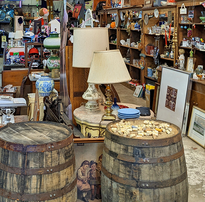 The lamp section glows with possibilities. These vintage barrels now cradle treasures instead of whiskey, though both bring warmth to a home.