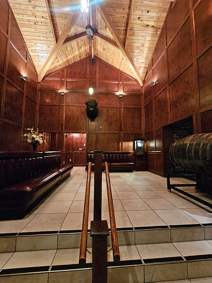 A waiting area that feels like the study of a successful friend who doesn't need to show off but somehow still does. That wooden ceiling means business.