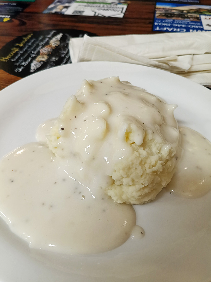 These mashed potatoes aren't just drowning in gravy—they're enjoying a luxurious spa treatment in it. Comfort food perfection.