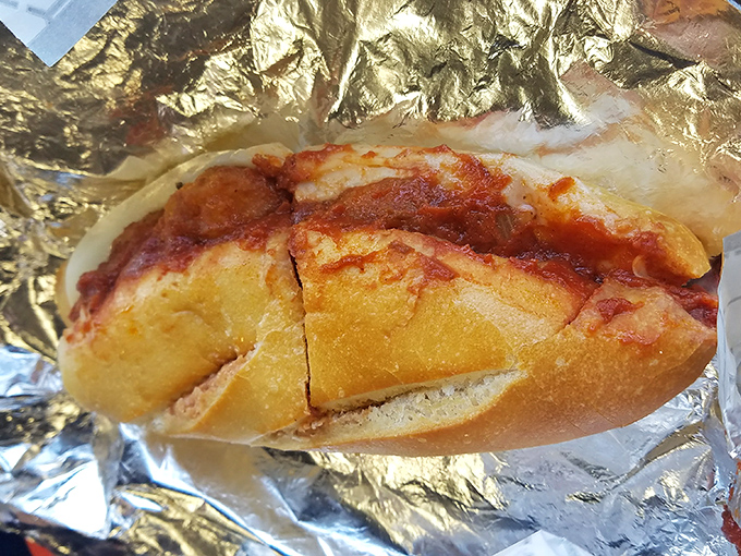 The meatball sandwich that makes grandmothers nervous. Those tender spheres of seasoned beef nestled in sauce are Sunday dinner in portable form.