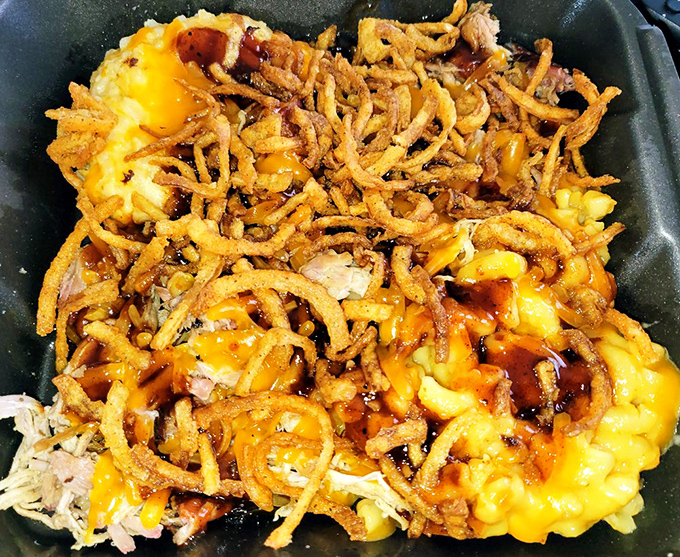 Mac and cheese topped with crispy onions is what happens when comfort food gets dressed up for a night on the town.