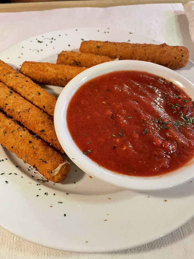 Mozzarella sticks with marinara sauce—the ultimate comfort food appetizer that takes you right back to your childhood happy place.