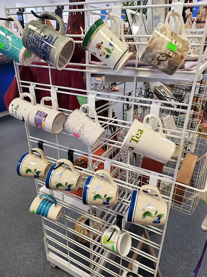 Mug hooks laden with ceramic personalities. That "Tea" mug might have comforted someone through breakups, job interviews, and winter colds.