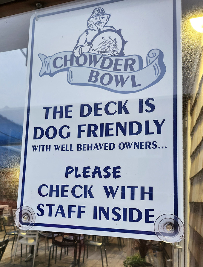 A sign that speaks volumes about the Chowder Bowl's personality—dog-friendly with a sense of humor that says "we don't take ourselves too seriously."