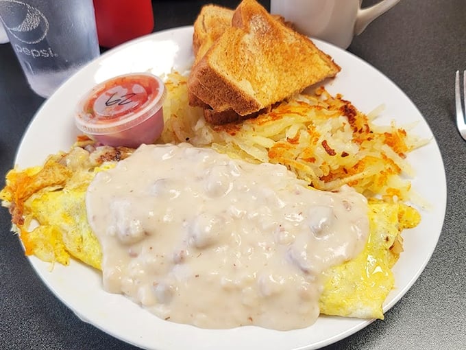 An omelet smothered in country gravy isn't just breakfast&mdash;it's a declaration that today is going to be exceptional. Those hashbrowns deserve their own fan club.