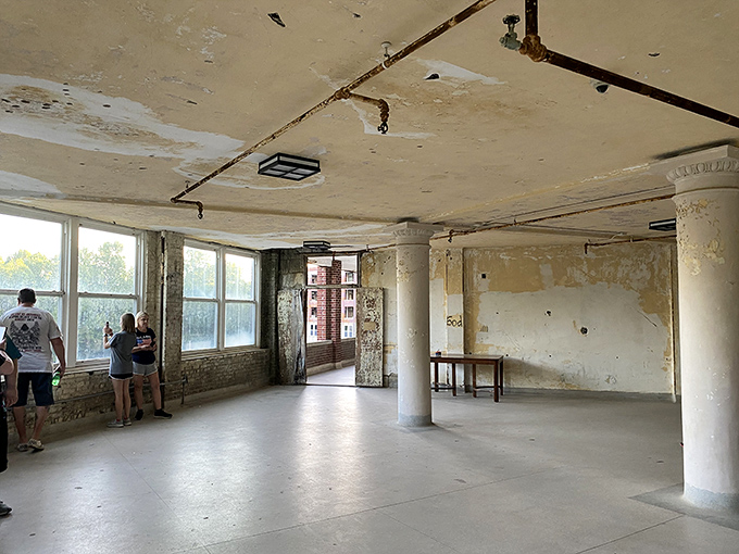 Institutional emptiness with a view. Large windows once provided tuberculosis patients with healing fresh air; now they frame Kentucky's landscape for visitors.