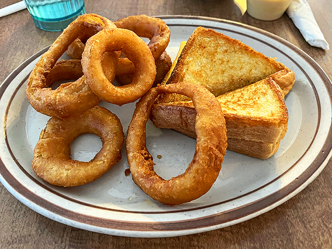 These onion rings aren't just side dishes &ndash; they're golden halos of happiness that crunch loud enough to turn heads.