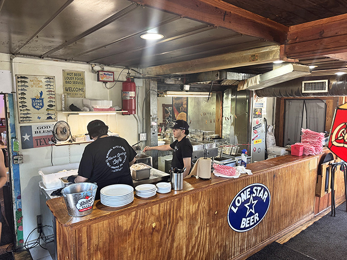 The open kitchen reveals the burger alchemy in action&mdash;no smoke, no mirrors, just honest cooking that keeps Texans coming back.