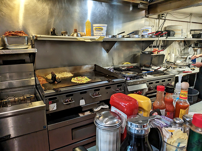 The kitchen – small but mighty – where breakfast magic happens at lightning speed. Those condiments have witnessed countless "mmms" and "aahs."