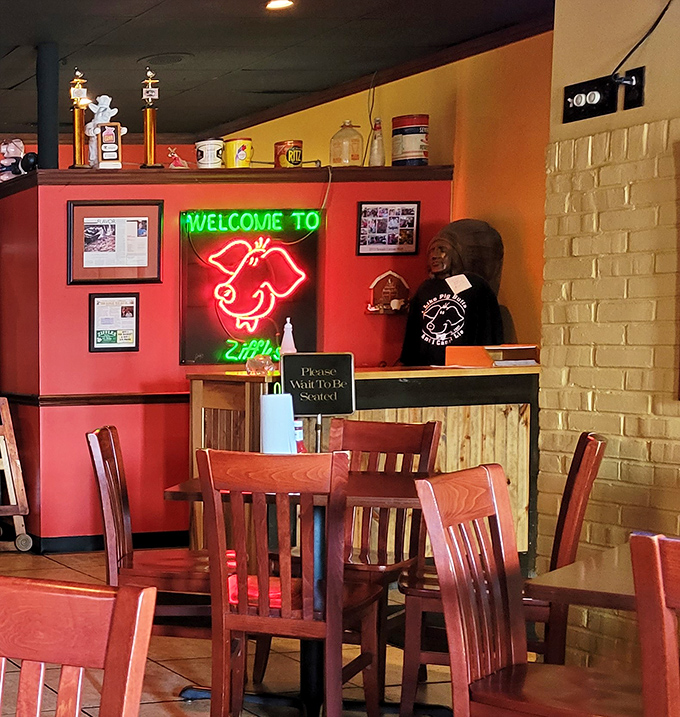 The neon pig sign welcomes you like an old friend who happens to be delicious. "Please Wait To Be Seated" means good things come to those who wait.
