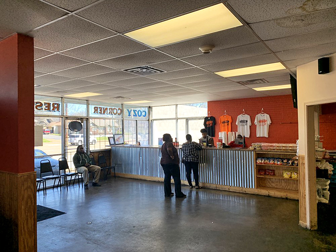 The counter where dreams come true. Those corrugated metal panels have absorbed decades of smoky wisdom.