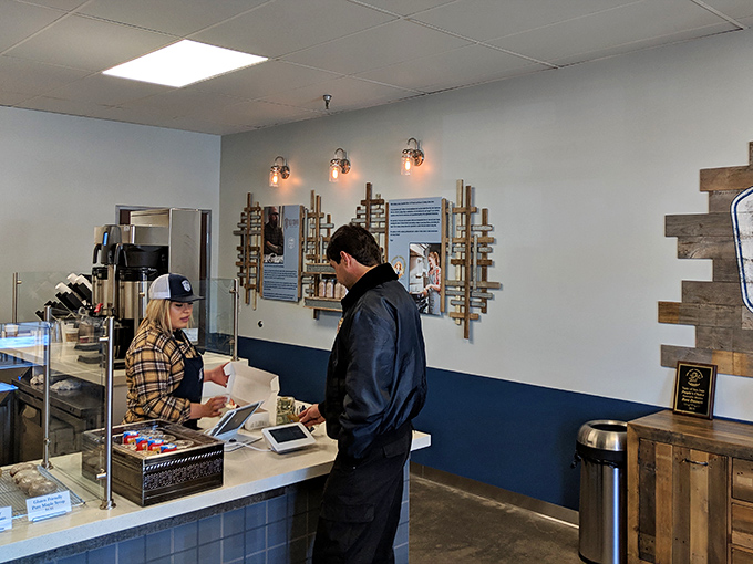 The moment of truth at the counter &ndash; where friendly faces guide you through the sweet dilemmas of donut selection.