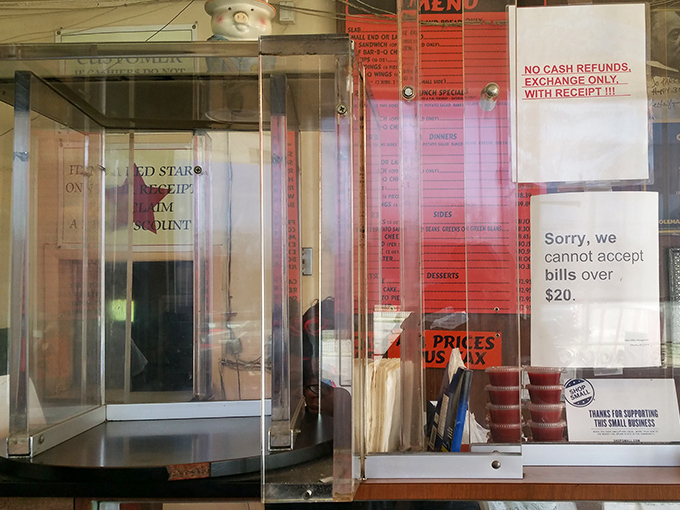 Even the signs tell you everything you need to know: cash only, small bills, big flavor. The economics of authentic barbecue are beautifully simple.