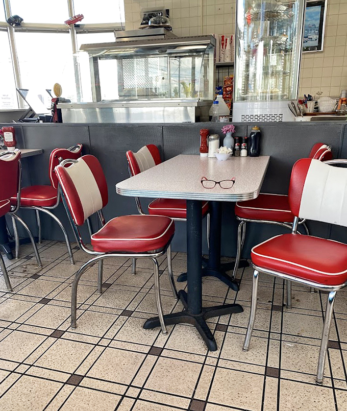 Those red and white chairs aren't just seating&mdash;they're time machines to when conversations happened face-to-face instead of screen-to-screen.