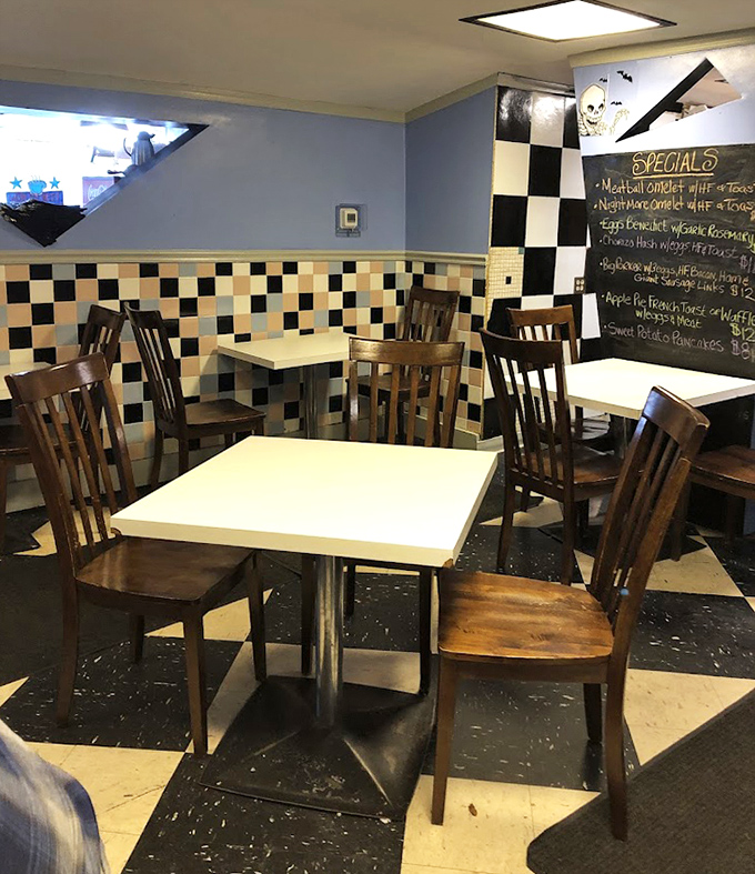 The checkered tile and colorful tables create dining nooks where memories are made over maple syrup and coffee refills.
