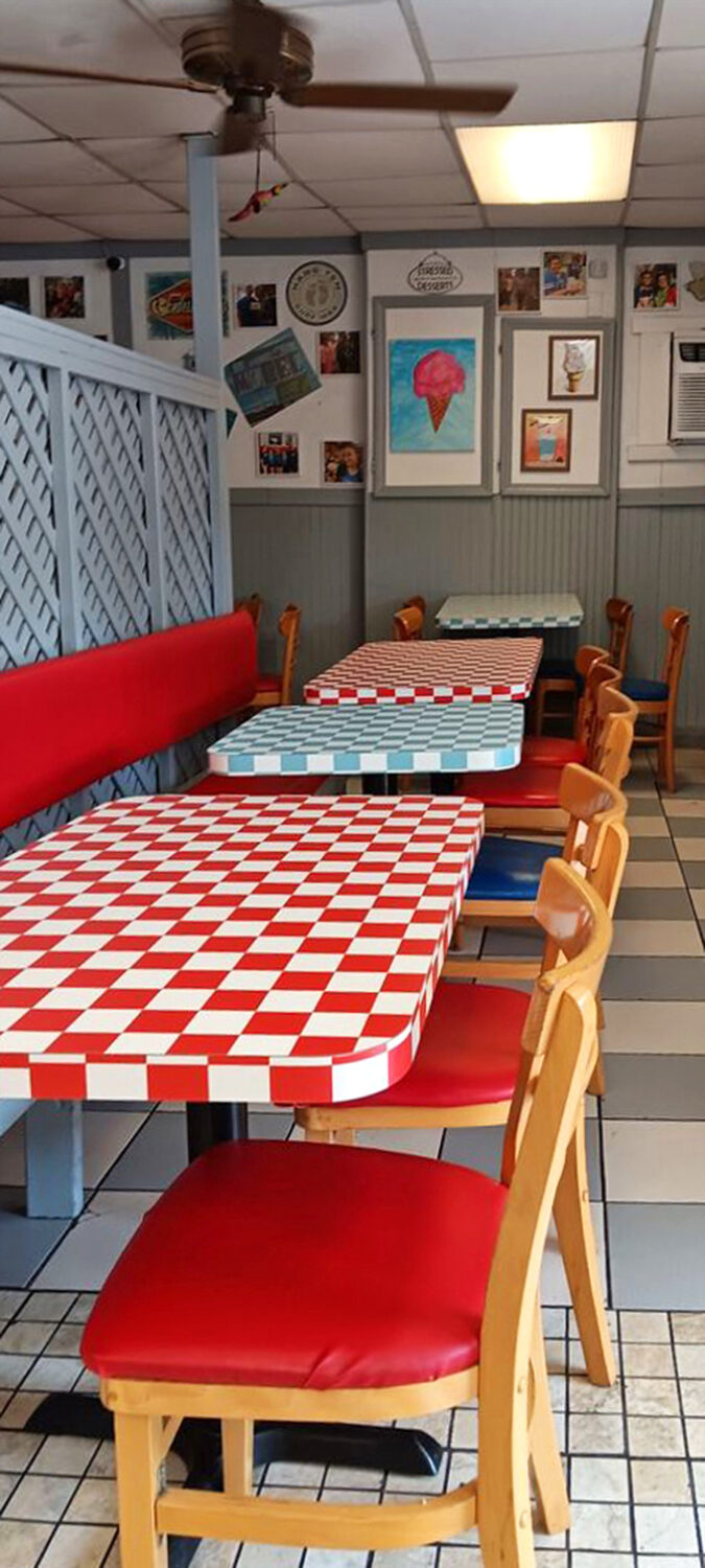 Red and blue checkered tables create a patriotic patchwork where memories are made between bites of ice cream and burgers.