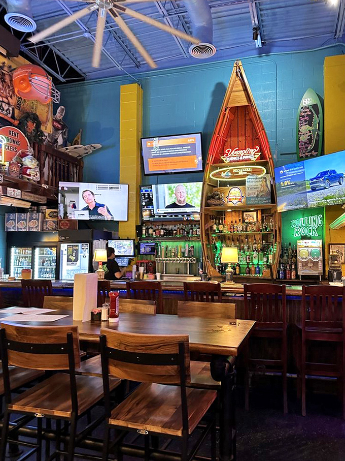 The bar area features a full-sized canoe because... why not? Where else can you drink surrounded by surfboards in landlocked Ohio?