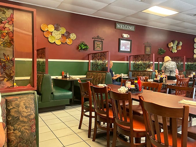 The two-tone walls and cozy booths create the perfect backdrop for both serious breakfast discussions and spontaneous syrup-induced naps.