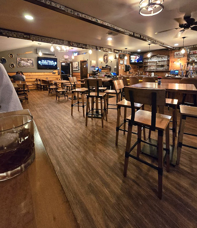 The bar area balances rustic charm with serious intent—these folks know their spirits as well as they know their steaks.