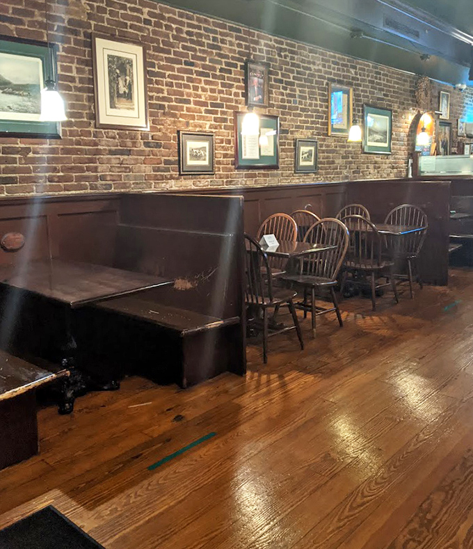 Wooden booths and exposed brick create the perfect backdrop for food memories. Those worn floors have supported countless happy diners over the years.