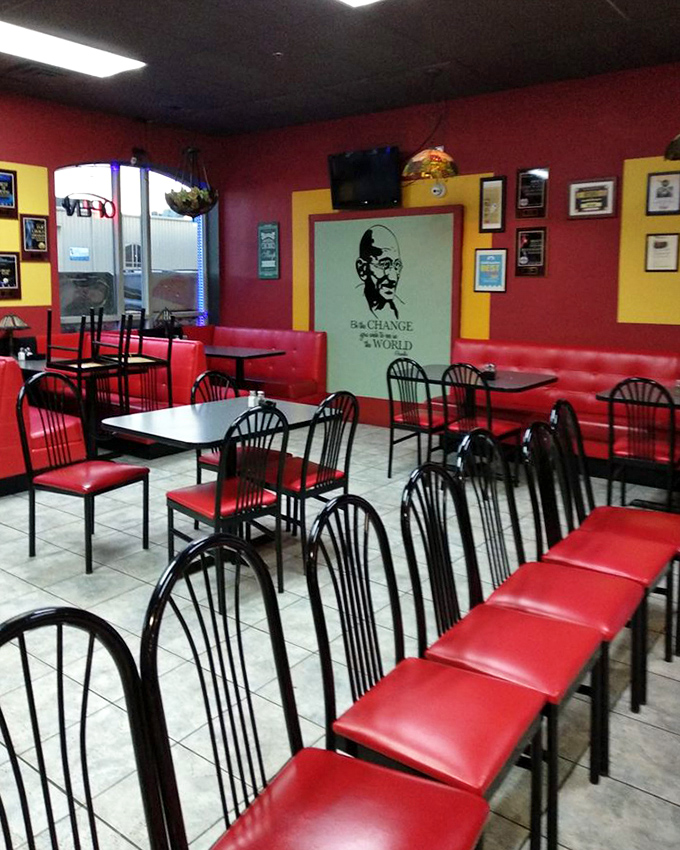 Red booths and Gandhi's watchful gaze create an atmosphere that says both "eat well" and "be the change you wish to see in the world."