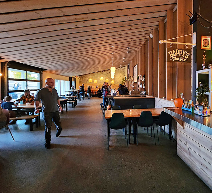 The wooden-lined interior creates an atmosphere that's somehow both rustic and modern&mdash;where conversations flow as easily as the drinks.