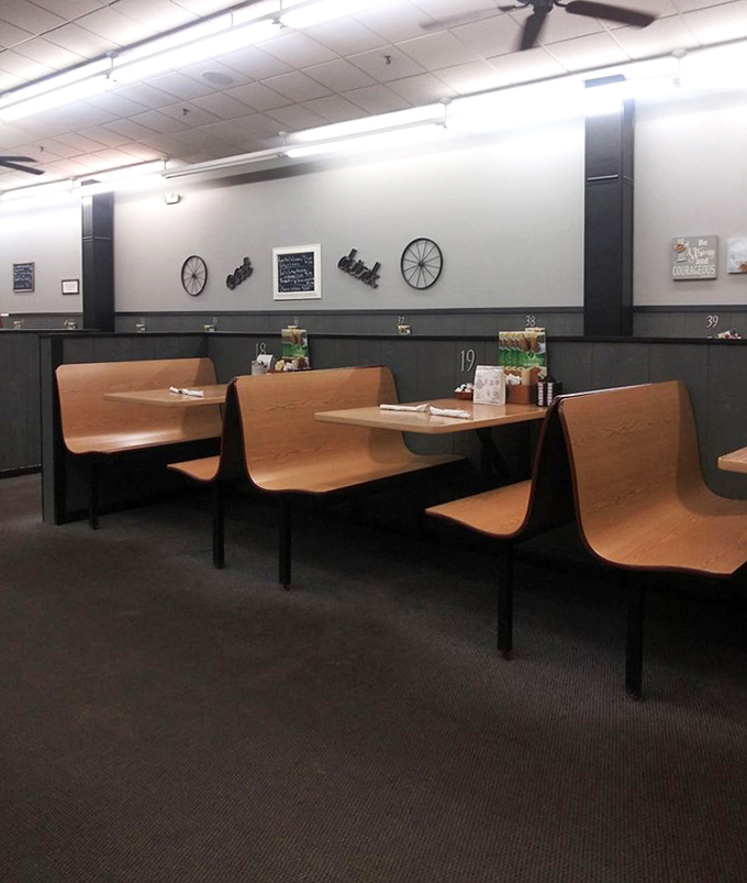 Booths numbered like highway exits, simple decor that says "we're serious about food, not wall art." Comfort has never looked so inviting.