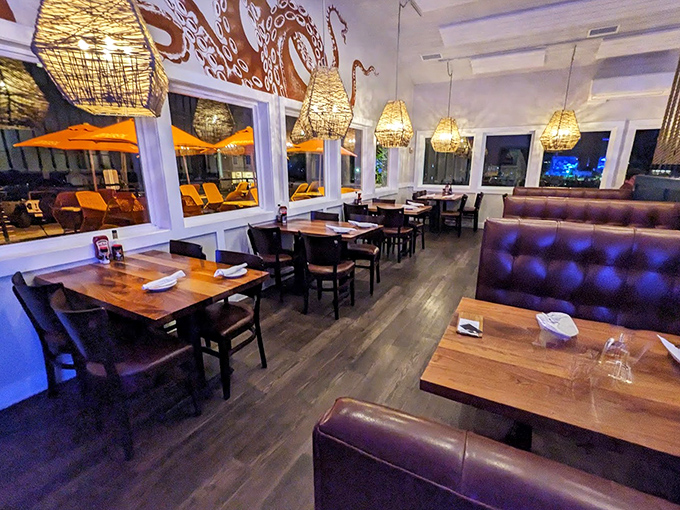 Evening transforms the dining room into an intimate escape, where wicker pendant lights cast a glow that makes everyone look like they're on vacation.