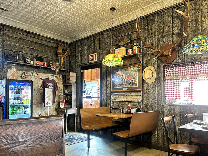 Another angle of the hunting-cabin-meets-diner interior, where every weathered board and antique tells a story about Ozark hospitality.