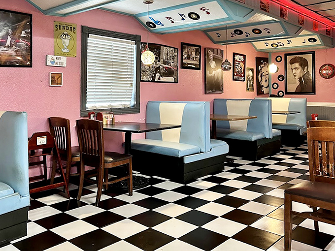 Pink walls, blue booths, and black-and-white photos&mdash;this isn't just decor, it's a visual love letter to American diner culture.
