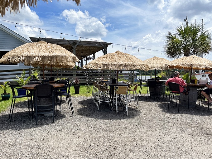 Tiki umbrellas and gravel underfoot create the perfect laid-back dining atmosphere. No dress code required, just bring your appetite.