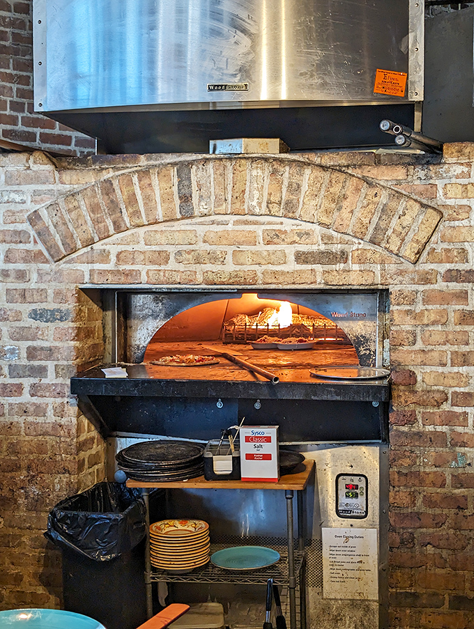 That brick oven glowing orange with 800-degree heat is where ordinary dough transforms into extraordinary pizza magic.