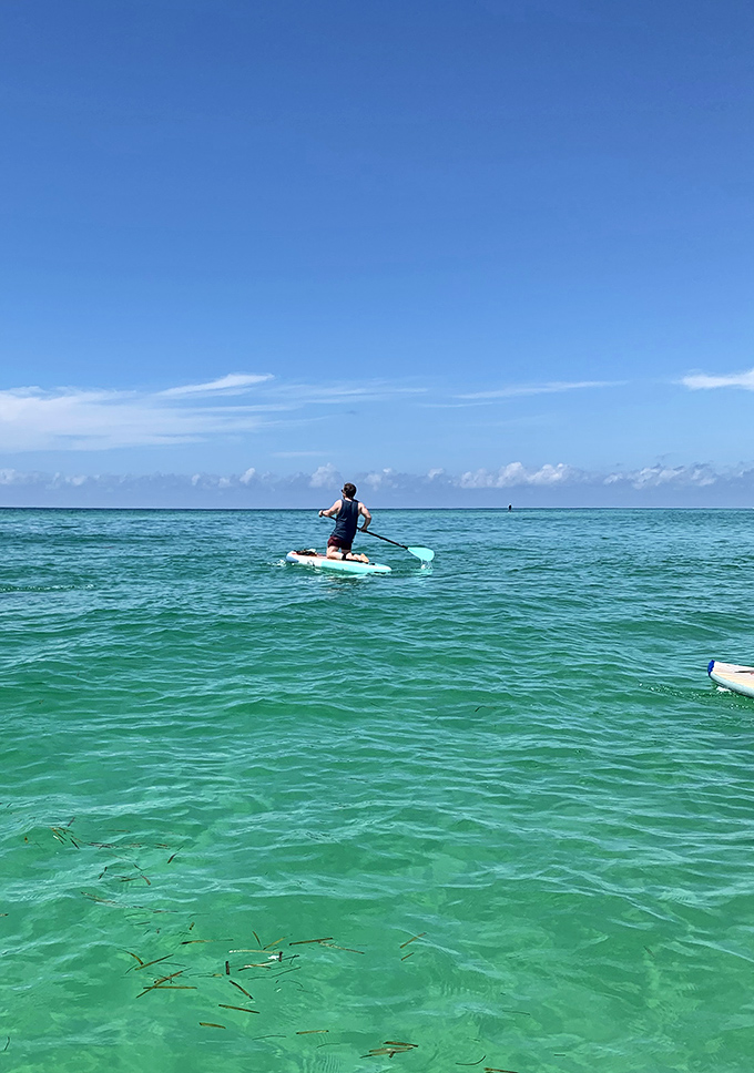 Paddleboarding on water so clear it looks Photoshopped. Finding your balance has never come with better views.