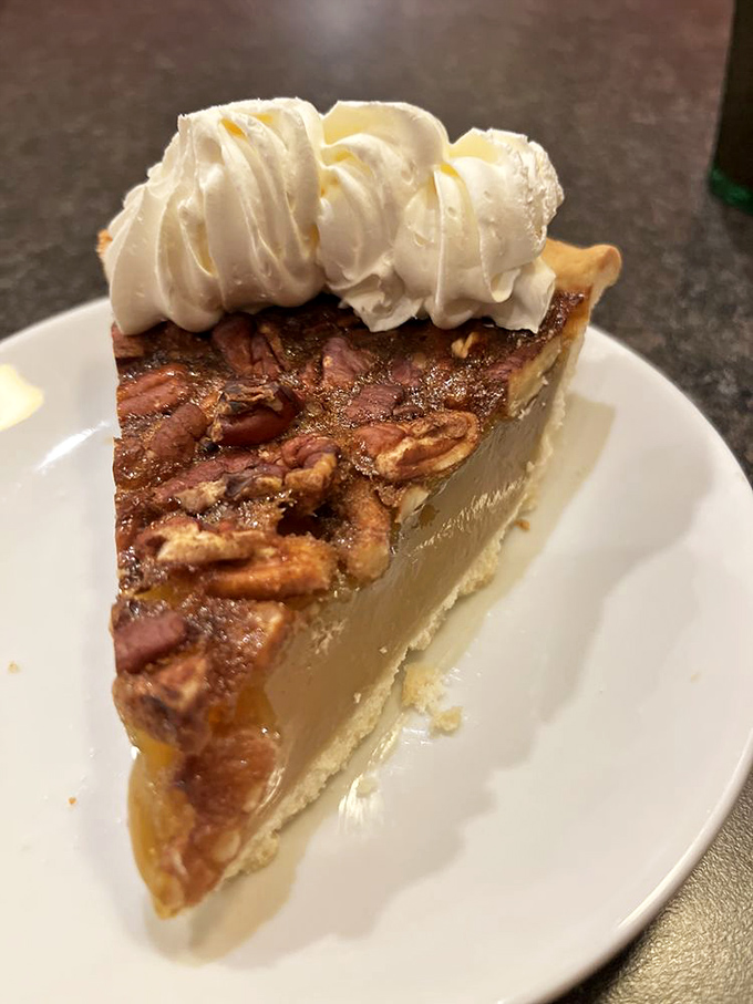 Pecan pie topped with whipped cream&mdash;the dessert equivalent of putting on your favorite sweater, if that sweater were made of butter and sugar.